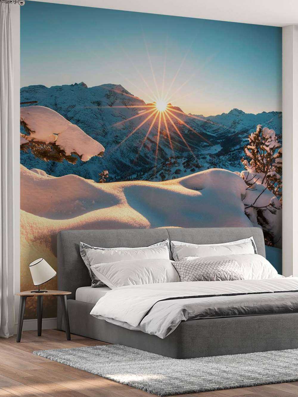 Fotobehang - Ochtendzon over besneeuwd dal - Fotobehang